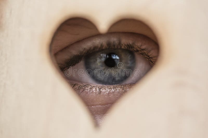An Eye Looking through a Heart Stock Photo - Image of peeking, mystery ...