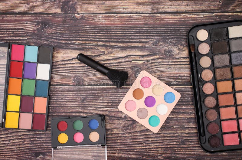 Eye Shadow Palettes and Make Up Brush on the Table Stock Photo - Image ...