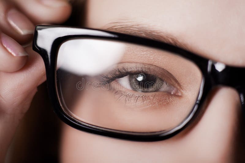 Eye shot through glasses stock photo. Image of beautiful - 23436042