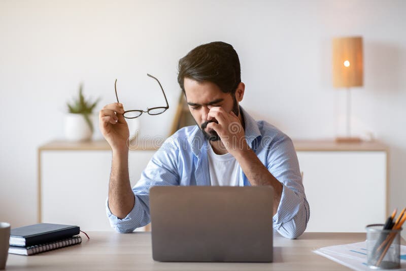 Eye Strain. Tired Arab Freelancer Guy Feeling Exhausted after Working ...