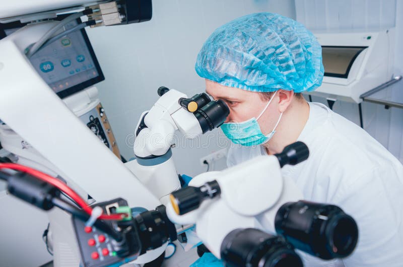 Eye Surgery. a Patient and Surgeon in the Operating Room Stock Photo ...