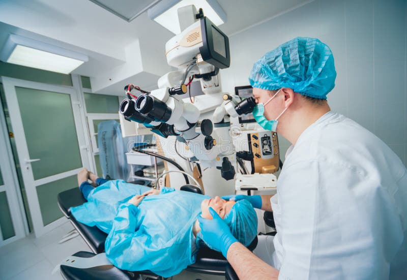 Eye Surgery. a Patient and Surgeon in the Operating Room Stock Photo ...