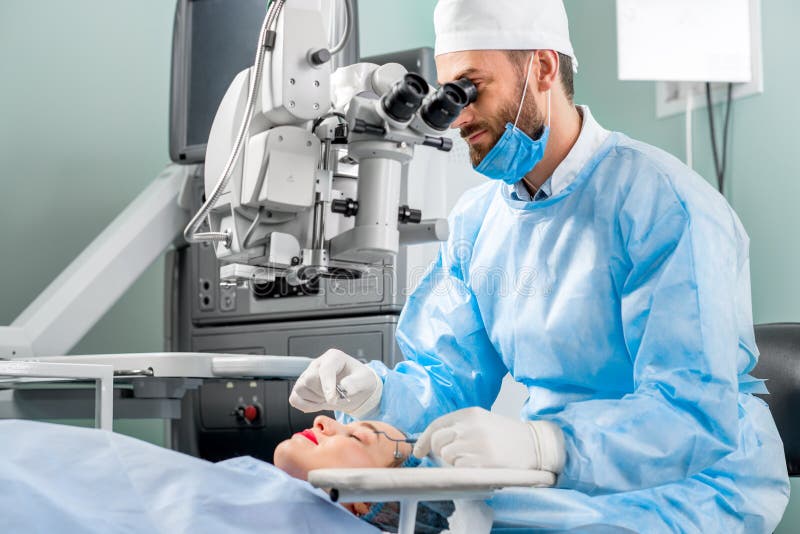 Opthamologist Performing Laser Eye Treatment Stock Photo - Image of ...
