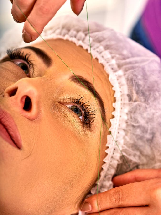 Eyebrow Threading - Epilation Procedure for Brow Shape Correction Stock ...