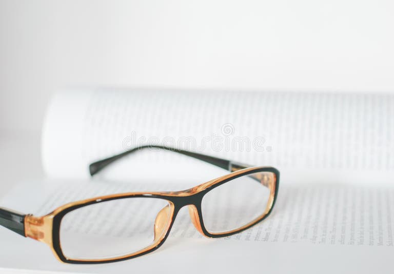 Eyeglass on book stock photo. Image of still, eyeglasses - 61074358