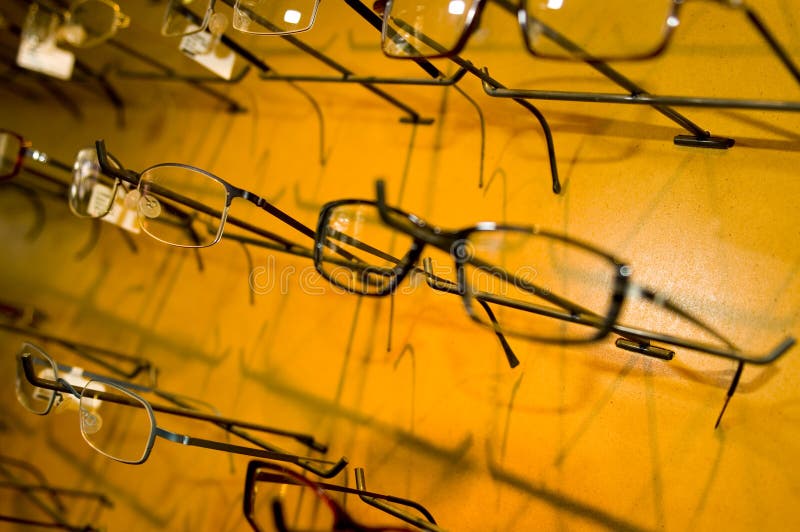 Eyeglasse Frames on Wall Display Stock Image - Image of frame, wood ...
