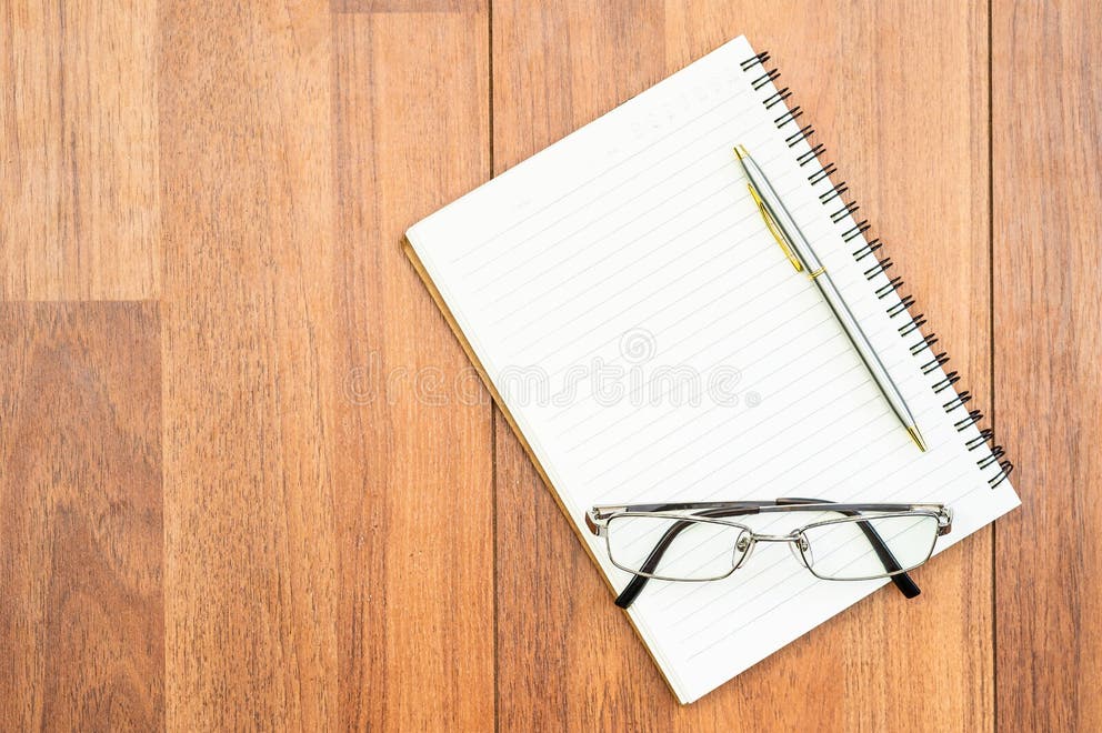 Eyeglasse and Notepad on Wood Deck with Copyspace Stock Image - Image ...