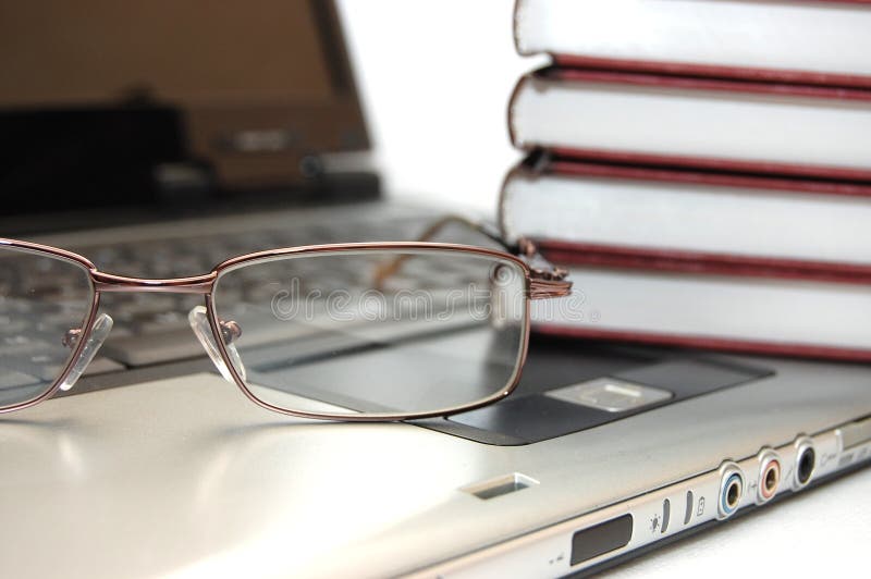 Eyeglasses and Books on Laptop Stock Photo - Image of pages, judgements ...