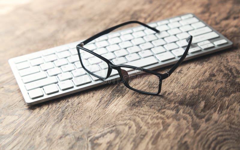Eyeglasses on Computer Keyboard Stock Image - Image of keyboard, office ...