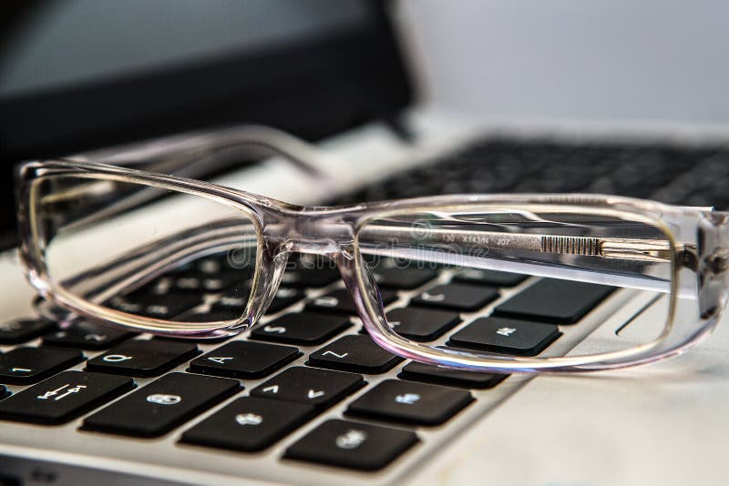 Eyeglasses with keyboard stock photo. Image of carta - 51967294