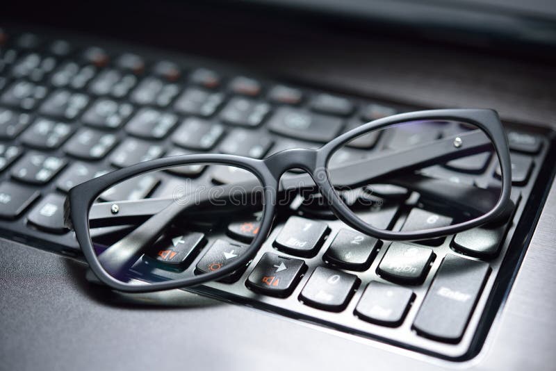 Eyeglasses on keyboard stock photo. Image of black, accessory - 65640500