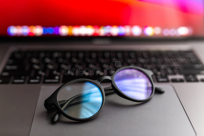 Eyeglasses on Keyboard of Opened Modern Laptop. Close Up Stock Image ...