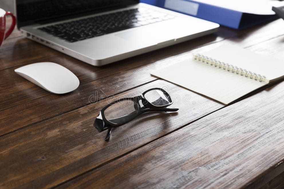Eyeglasses, Laptop Computer and Notebook on Office Desk Stock Photo ...