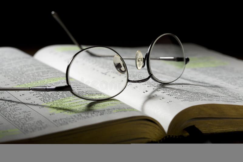 Eyeglasses on Open Bible stock image. Image of glasses - 11975945