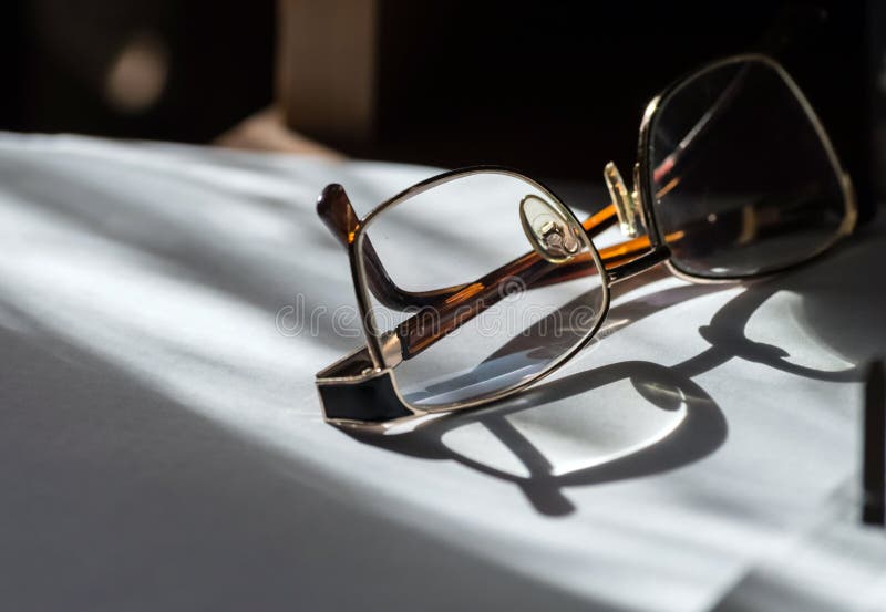 Eyeglasses on a White Background with Shadows. Selective Focus. Stock ...