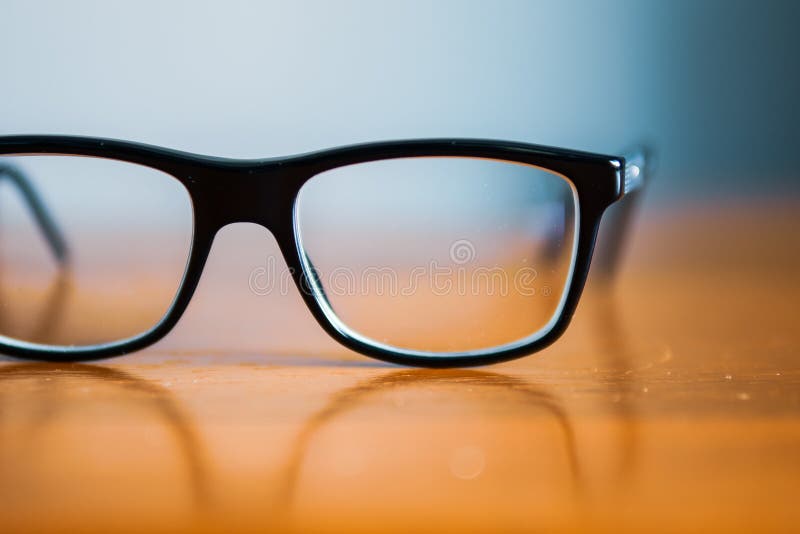 Eyeglasses on wooden table stock image. Image of vision - 132891895