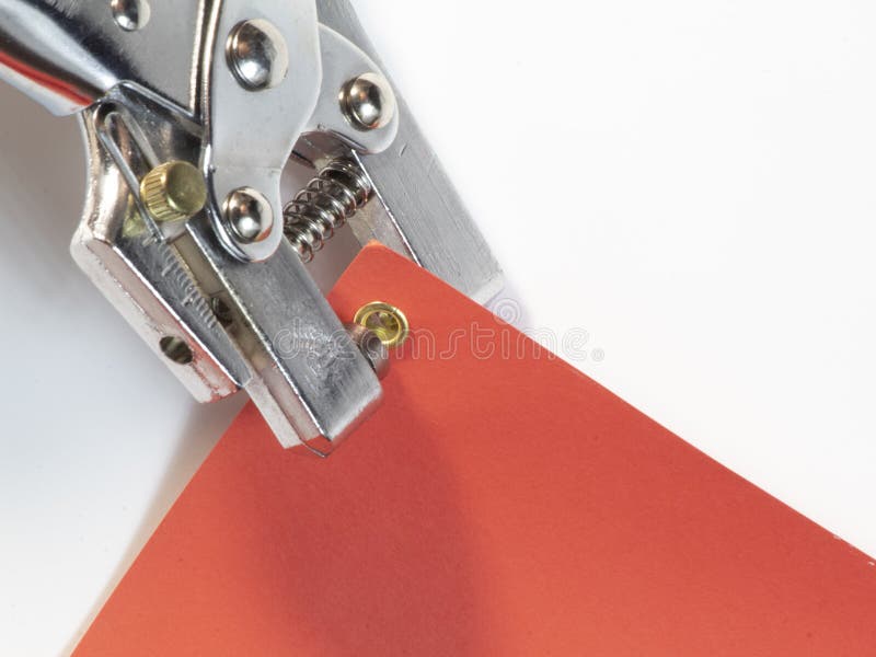 Eyelet Installer in Action on Paper Stock Image - Image of hole ...