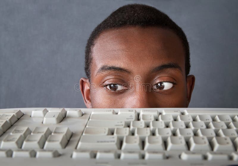 Eyes of Man Above Keyboard stock image. Image of overview - 19466907