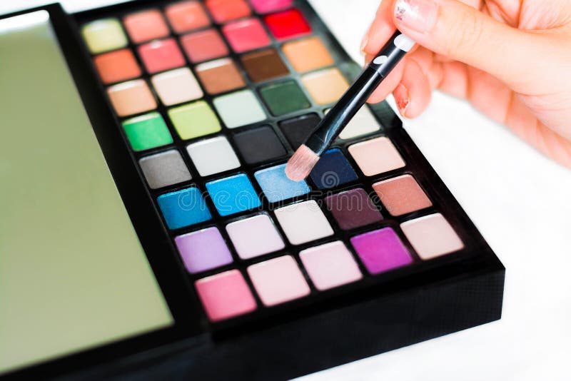 Eyeshadow Palette Closeup with a Woman Hand Stock Photo - Image of ...