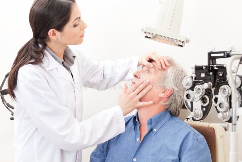 Eye Doctor Performing Eye Examination Stock Image - Image of ophthalmic ...
