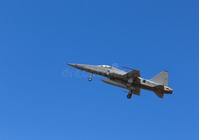 F5 Fighter Jet Flying on Blue Sky Background. Stock Photo - Image of ...