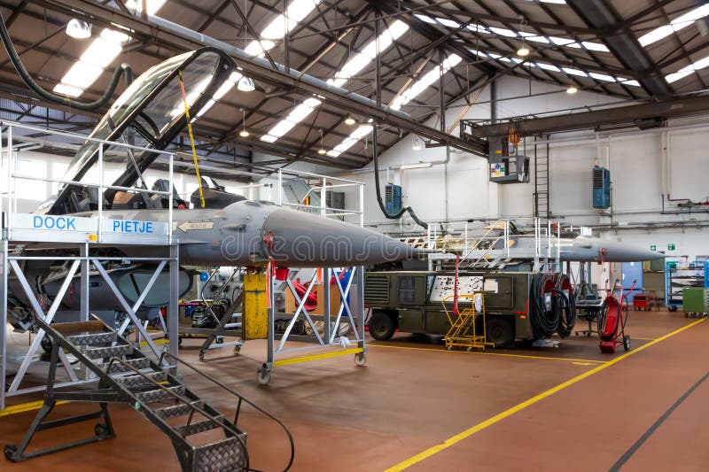 F-16 Fighter Jets in a Servicing Hangar at an Air Base. Editorial Stock ...