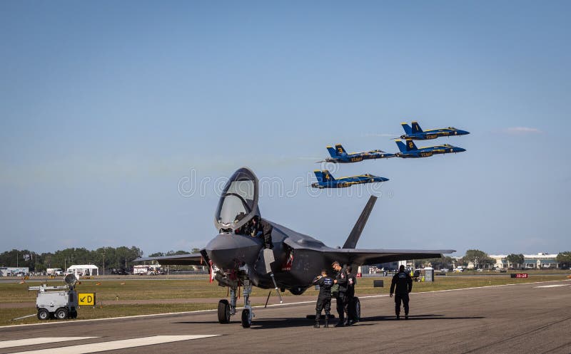 F-35 Jet with Mechanics and Blue Angels Overhead Editorial Image ...