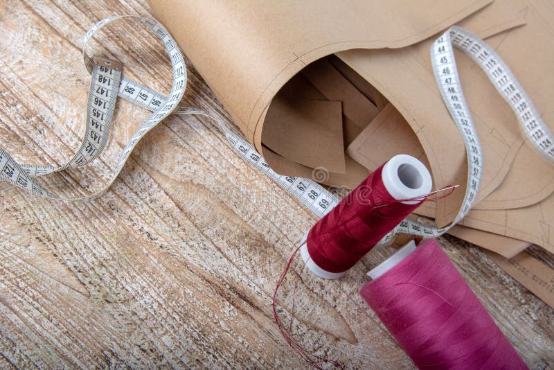 Fabric and Objects for Sewing Clothes. Roulette, Coil, and Patterns on ...