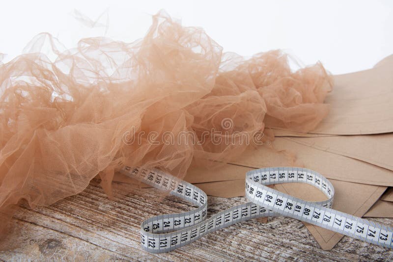 Fabric and Objects for Sewing Clothes. Roulette and Patterns on the ...