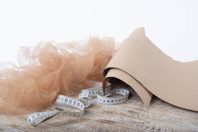 Fabric and Objects for Sewing Clothes. Roulette and Patterns on the ...