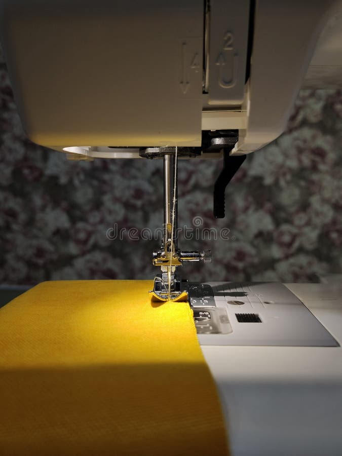 Sewing Machine and Yellow Fabric Stock Image - Image of metal, foot ...