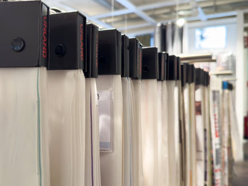 Fabric Samples Display in Retail Store with Various Textures and Colors ...