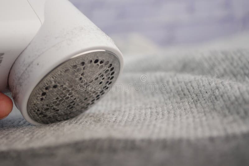 Fabric Shaver Removing Lint from Gray Textile Surface Stock Image ...