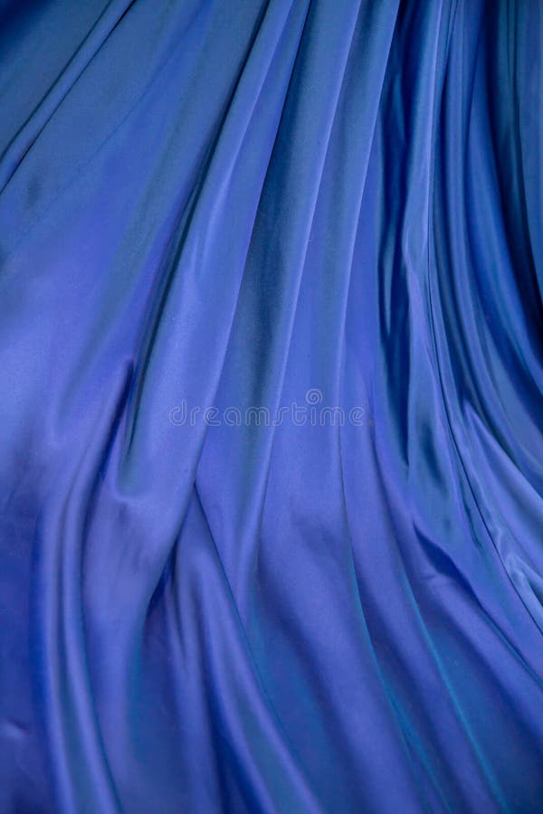 The Fabric is a Shiny Blue Color Arranged in Beautiful Waves. Stock ...