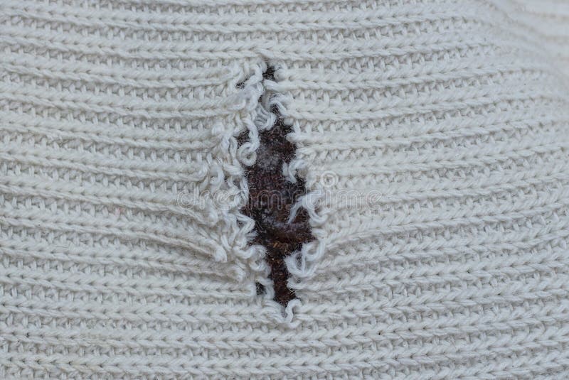 Fabric Texture of Torn Wppl Knited Clothes with a Hole Stock Photo ...