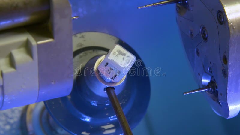 The Milling Machine Cuts the Ceramic Dental Crown from the Workpiece ...