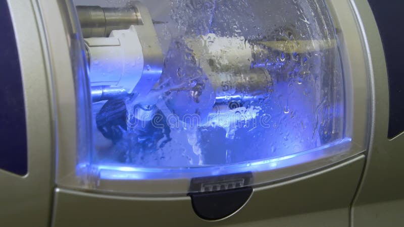 The Milling Machine Cuts the Ceramic Dental Crown from the Workpiece ...