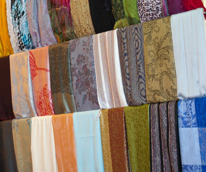 Fabrics on a market stall stock photo. Image of brown - 13272172