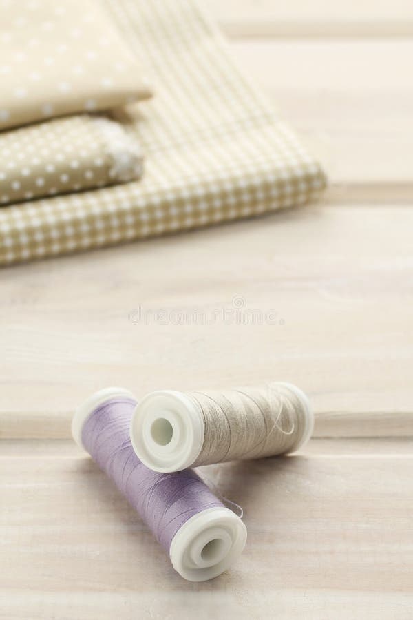 Fabrics and Threads on Wooden Table Stock Photo - Image of sewing ...