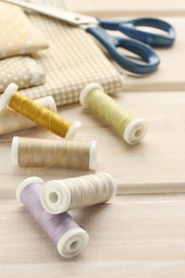 Fabrics and Threads on Wooden Table Stock Photo - Image of material ...