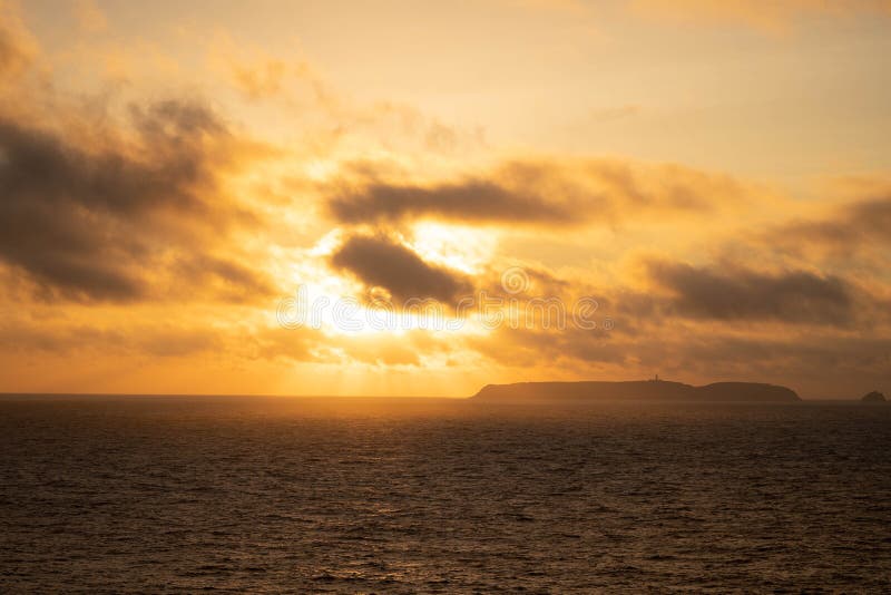 Fabulous Sunset, the Sun Sets Behind the Island in the Distance Stock ...