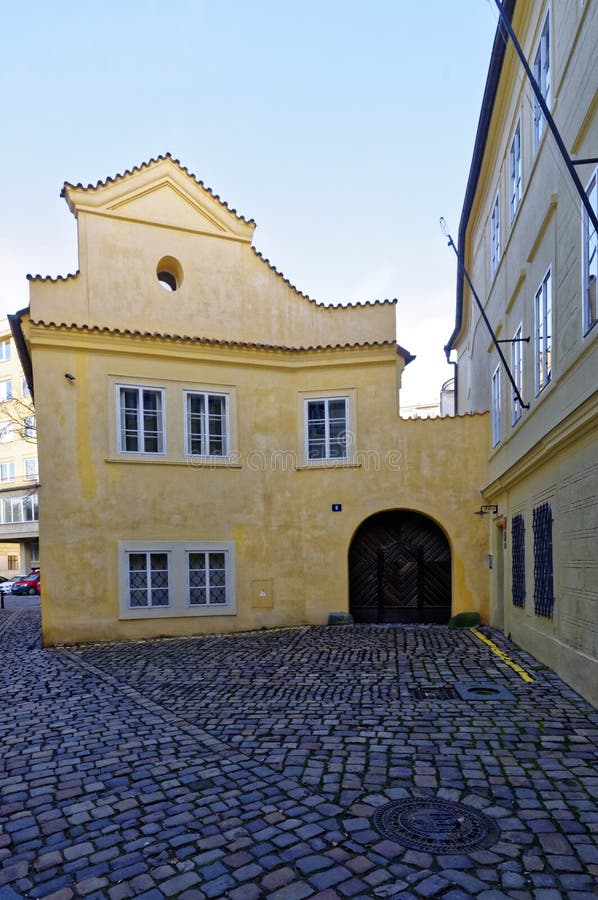 Facade of an Art Deco Building with a Small Black Gate on the Side is ...