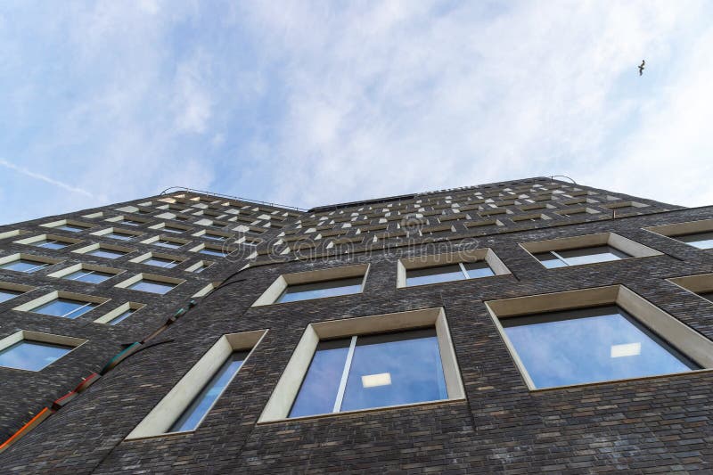 The Facade of a Beautiful Brick Building Against the Backdrop of a ...