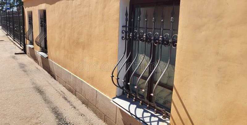 Facade with Beautiful Curved Iron Window Grilles Stock Image - Image of ...