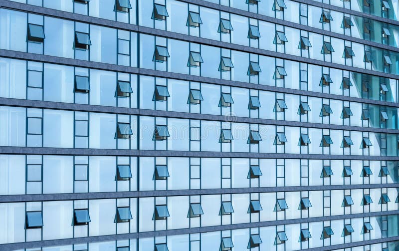 Facade of a Blue Glass Office Building with Open Windows and Steel ...