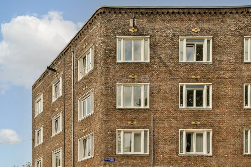 The Facade of a Brick Building with Windows Stock Photo - Image of ...