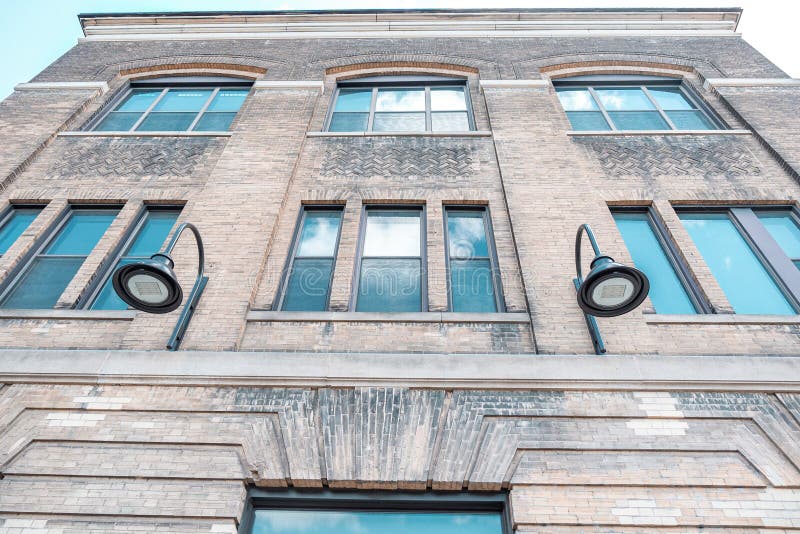 Facade of Brick Wall Building with Windows and Screens. Looking Up ...