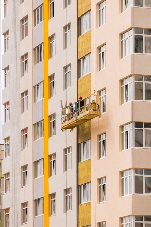 Builders Paint the Facade of a High-rise Residential Building Stock ...