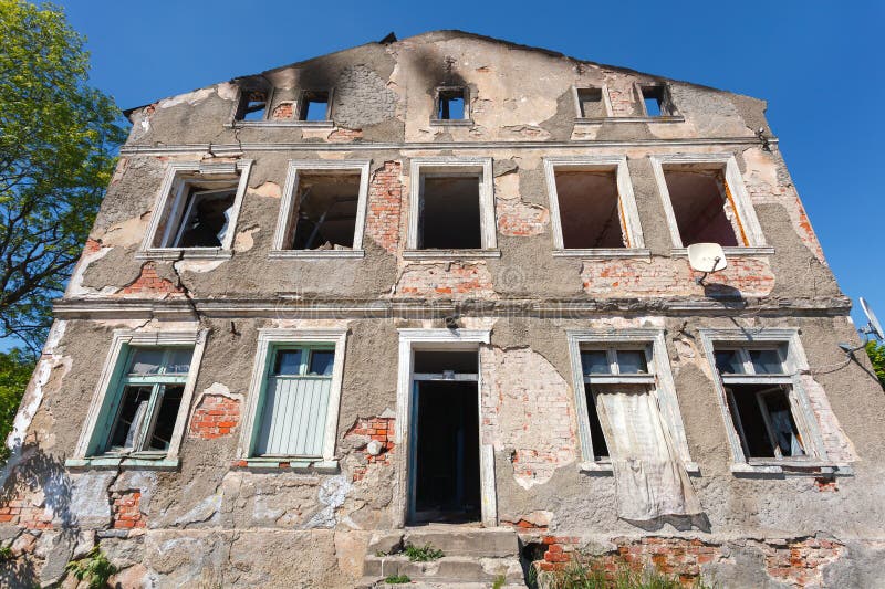 The Facade of the Building with Broken Windows. the House after the Fire Stock Photo - Image of ...
