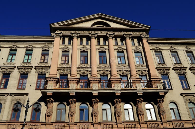The Facade of the Building with Columns and Sculptures, Stucco Over the ...